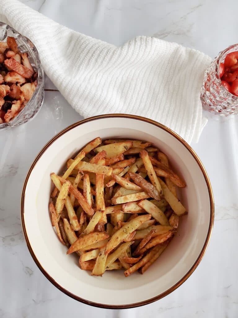 Breakfast Poutine with Homemade Hollandaise Sauce - Your Wandering Foodie